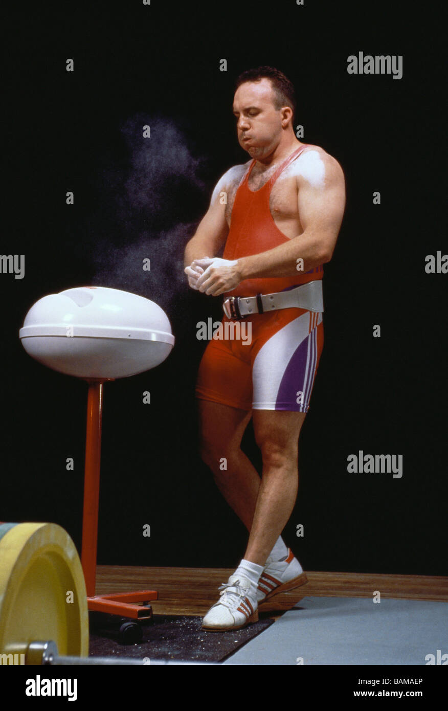 Olympic style weightlifter in action Stock Photo - Alamy