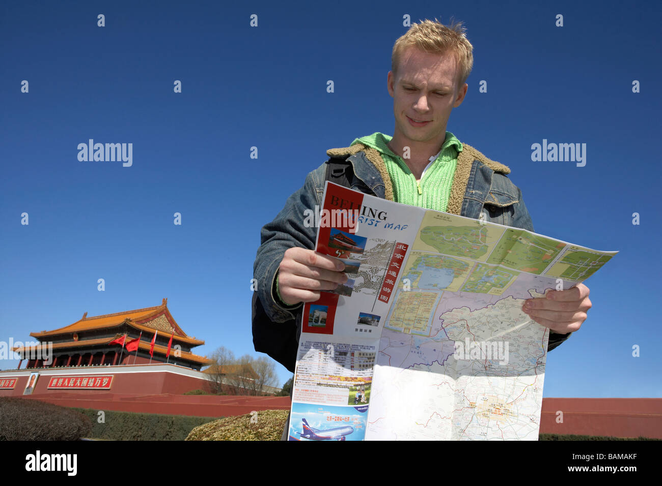 Young Man Looking At Map Stock Photo - Alamy