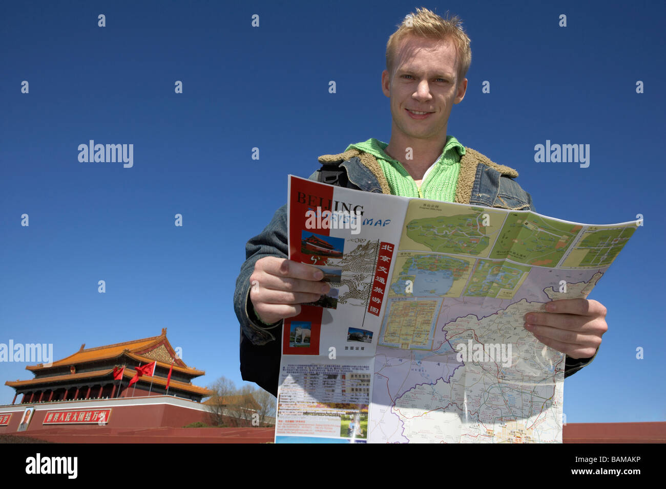 Young Man Looking At Map Stock Photo - Alamy