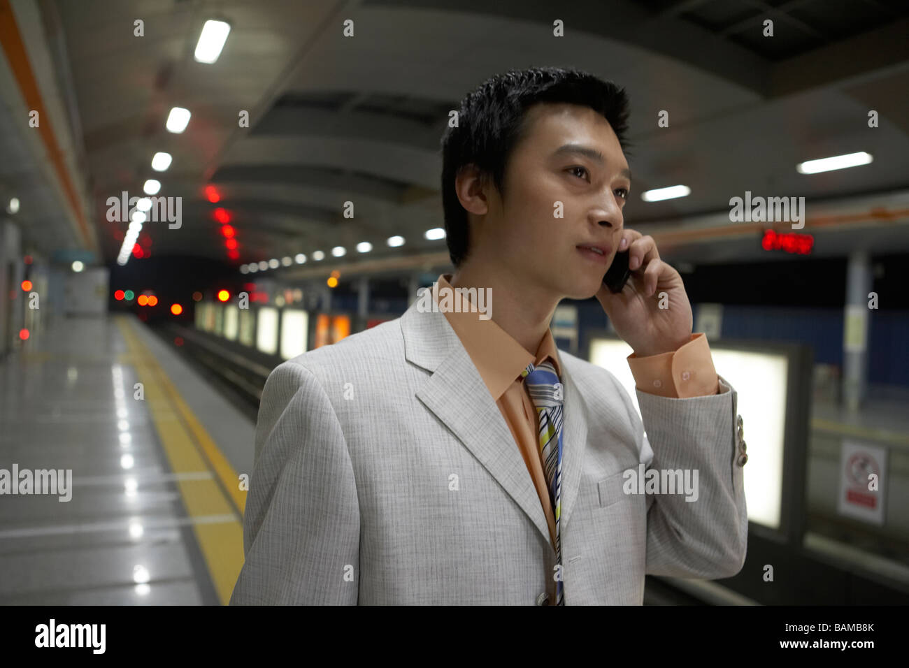 Asian man talking cellphone train hi-res stock photography and images ...