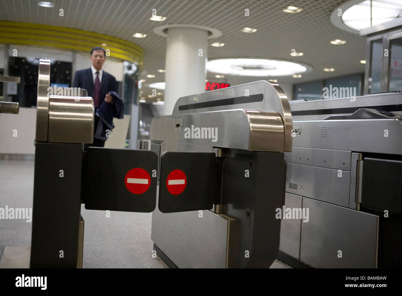 A Man Approaching The Ticket Gates At A Subway Station Stock Photo - Alamy