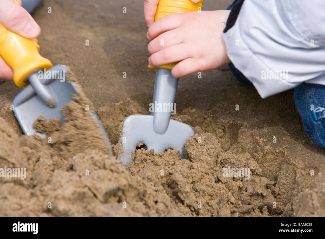 child diging in the sandy beach Stock Photo - Alamy