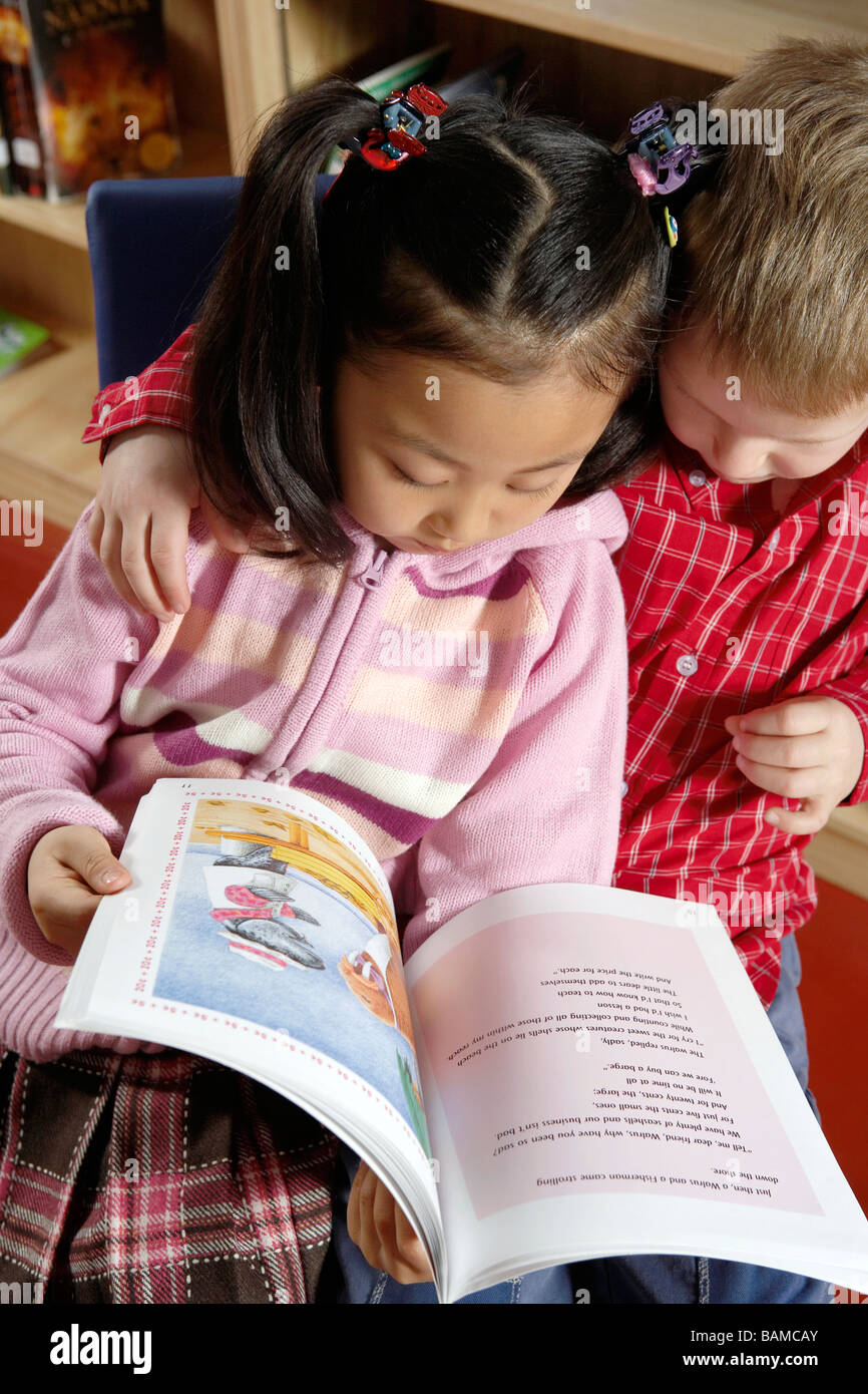 Children Reading Book Together Stock Photo - Alamy