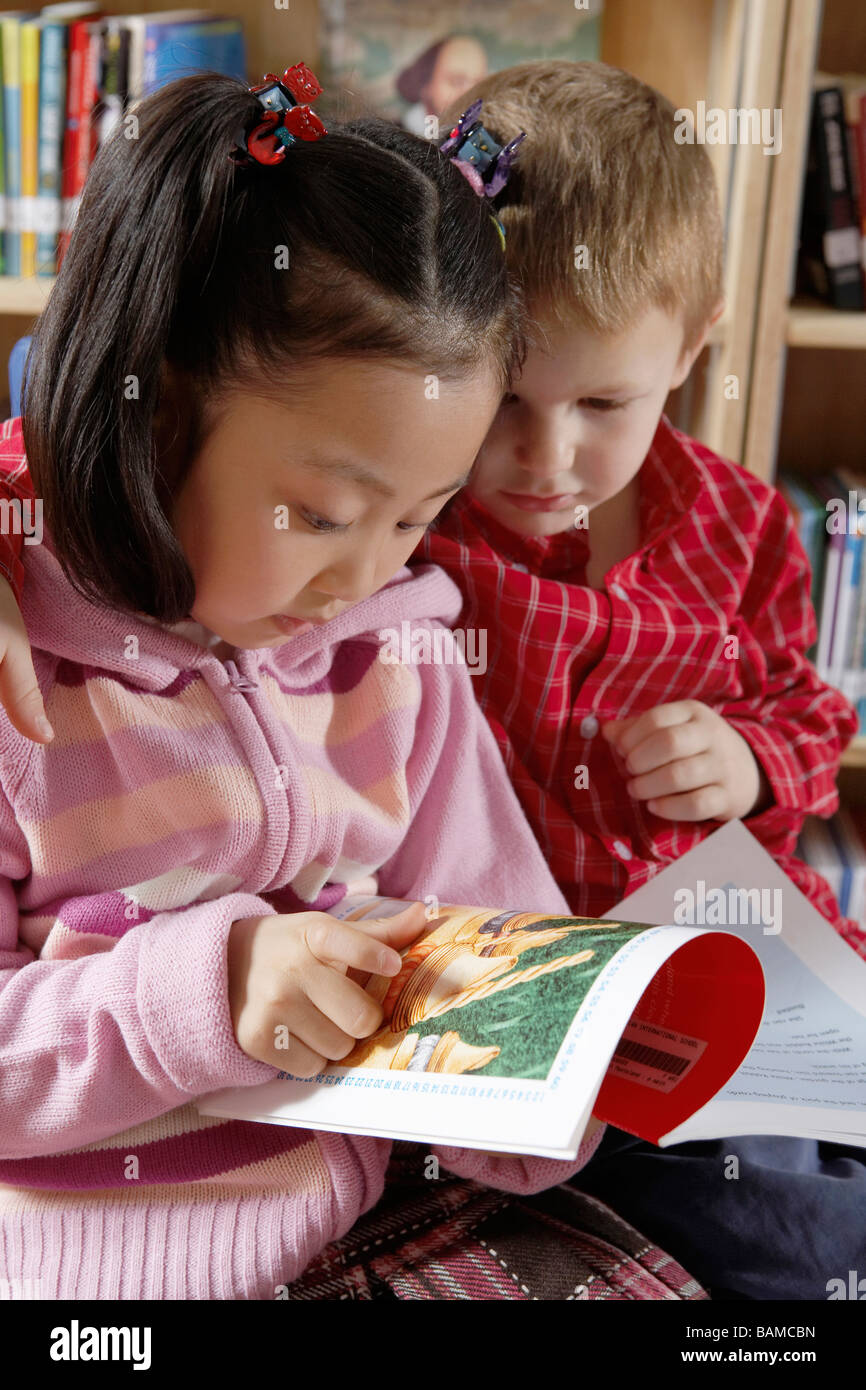Children Reading Book Together Stock Photo - Alamy