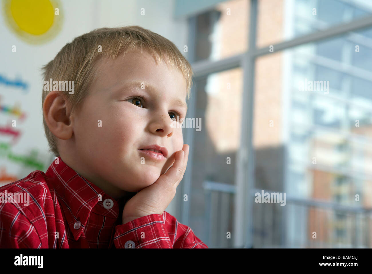 Boy Looking Into Distance Stock Photo - Alamy