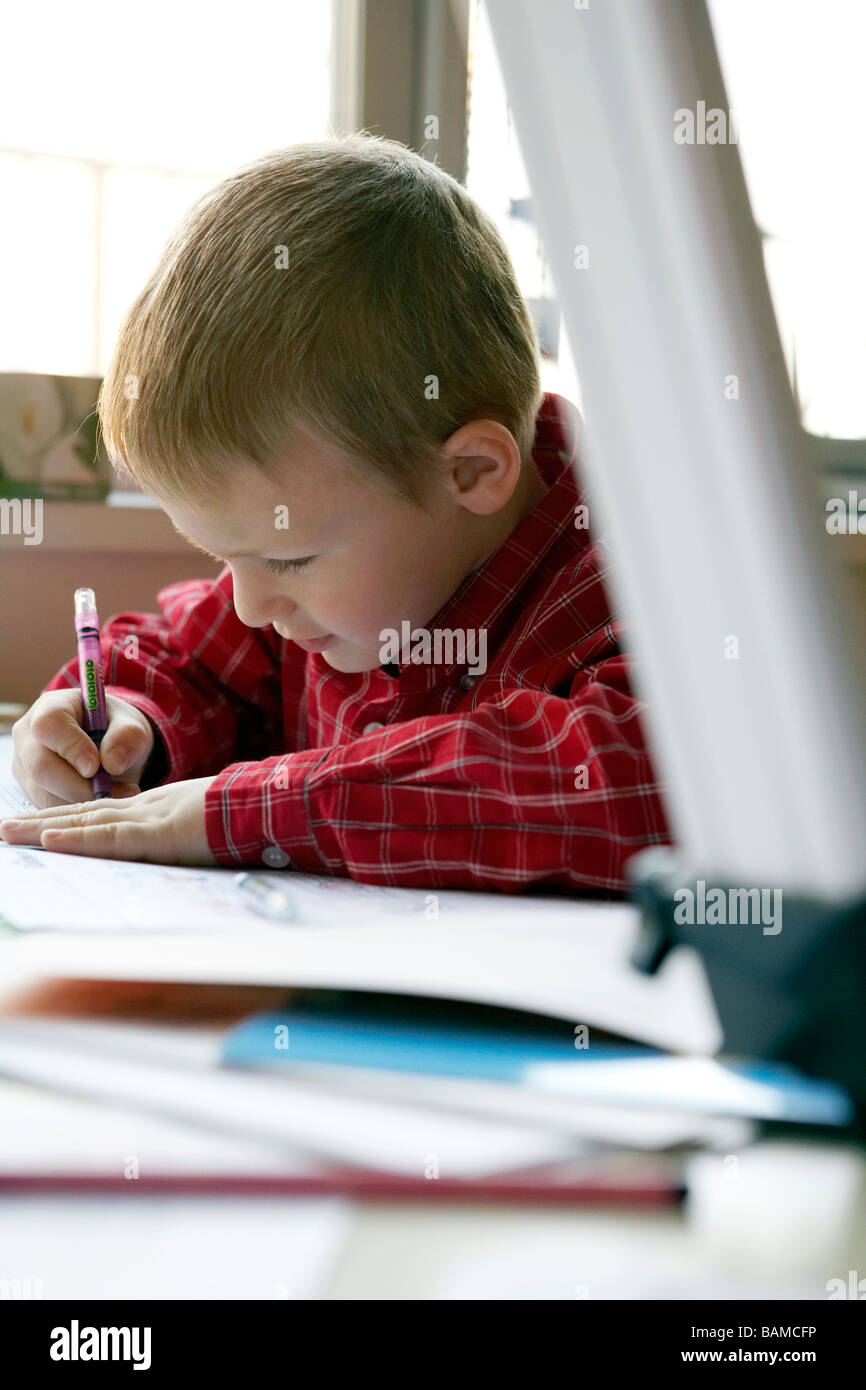 Small Boy Learning To Write Stock Photo - Alamy