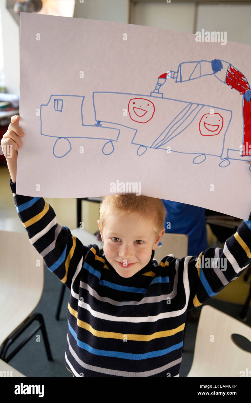 Boy Holding Drawing Up Stock Photo - Alamy