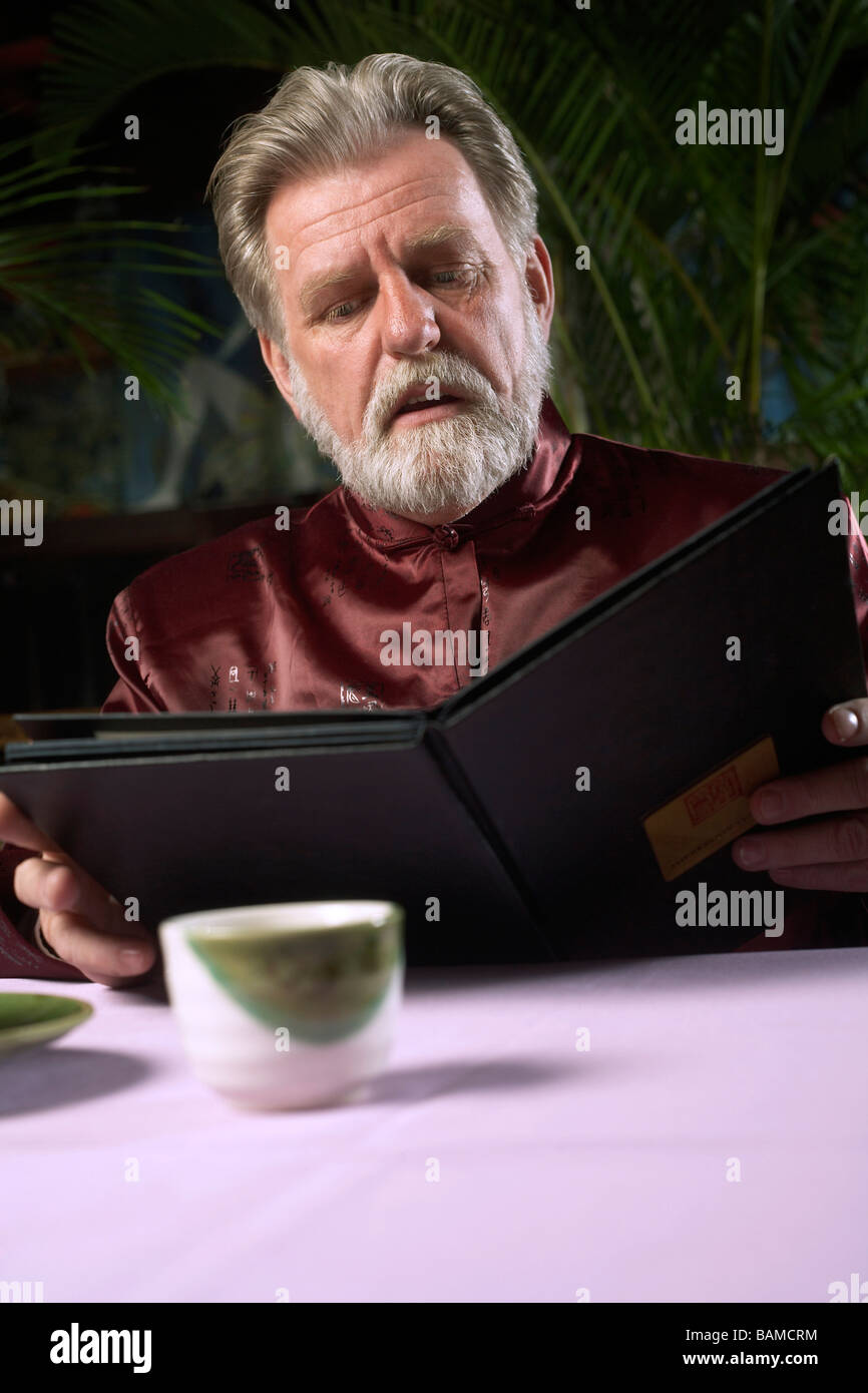 Man Reading Menu At Restaurant Stock Photo - Alamy