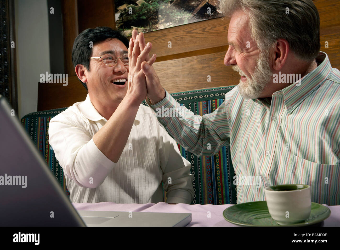 Men High-Fiving Each Other Stock Photo - Alamy