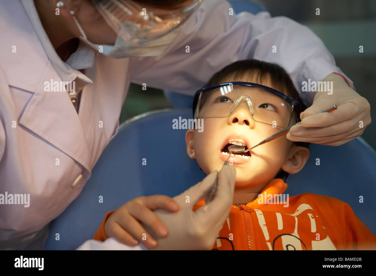 Dentist Examining Boy's Teeth Stock Photo - Alamy