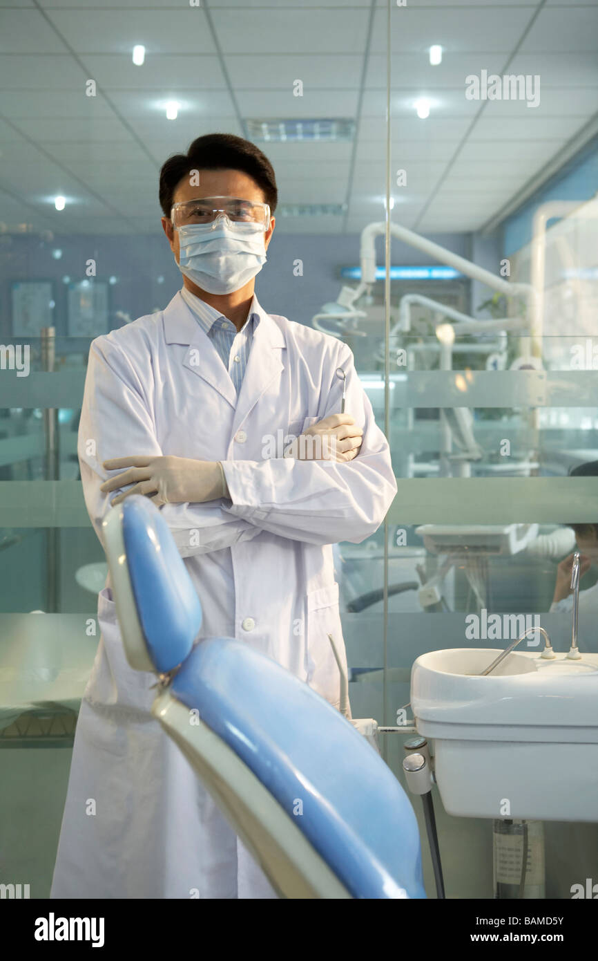 Dentist Standing In Dental Surgery Stock Photo - Alamy