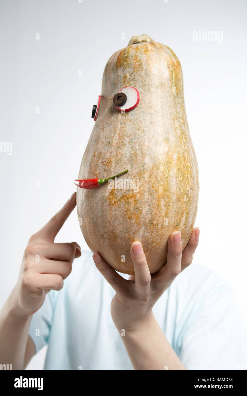 Male Covering Face With Vegetable Mask Stock Photo - Alamy