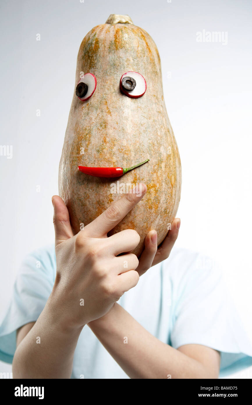 Male Covering Face With Vegetable Mask Stock Photo - Alamy
