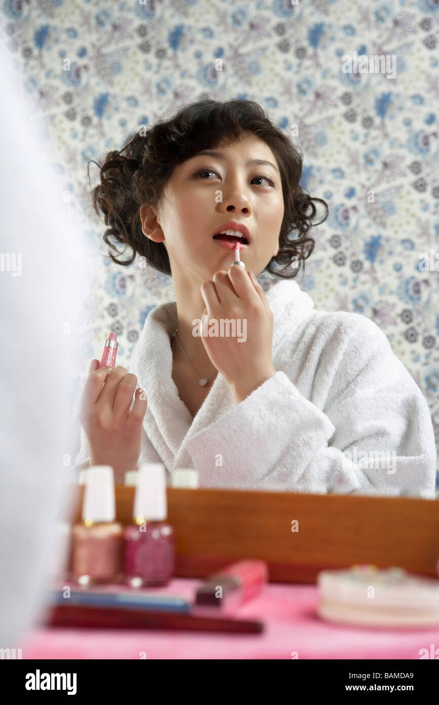 Young Woman Applying Makeup Stock Photo - Alamy