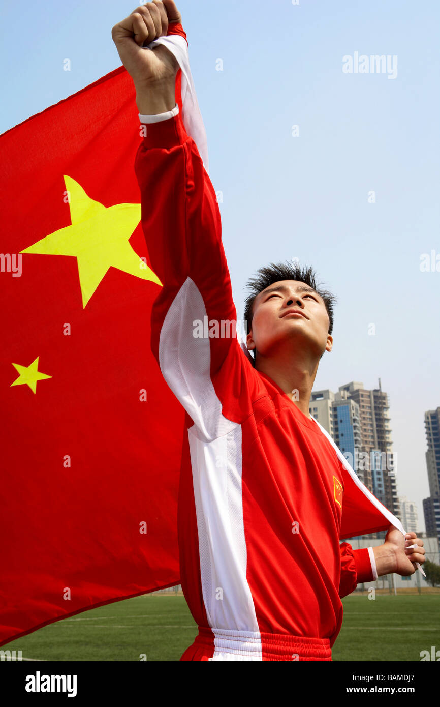 Chinese Athlete Holding The Chinese Flag With Pride Stock Photo - Alamy