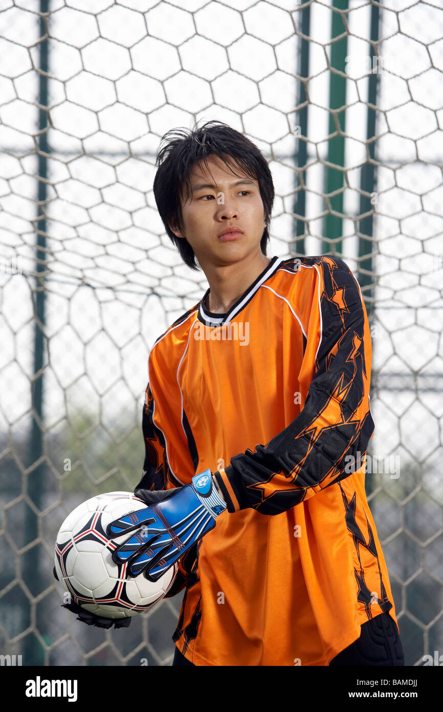 Goalkeeper Holding Soccer Ball Stock Photo - Alamy