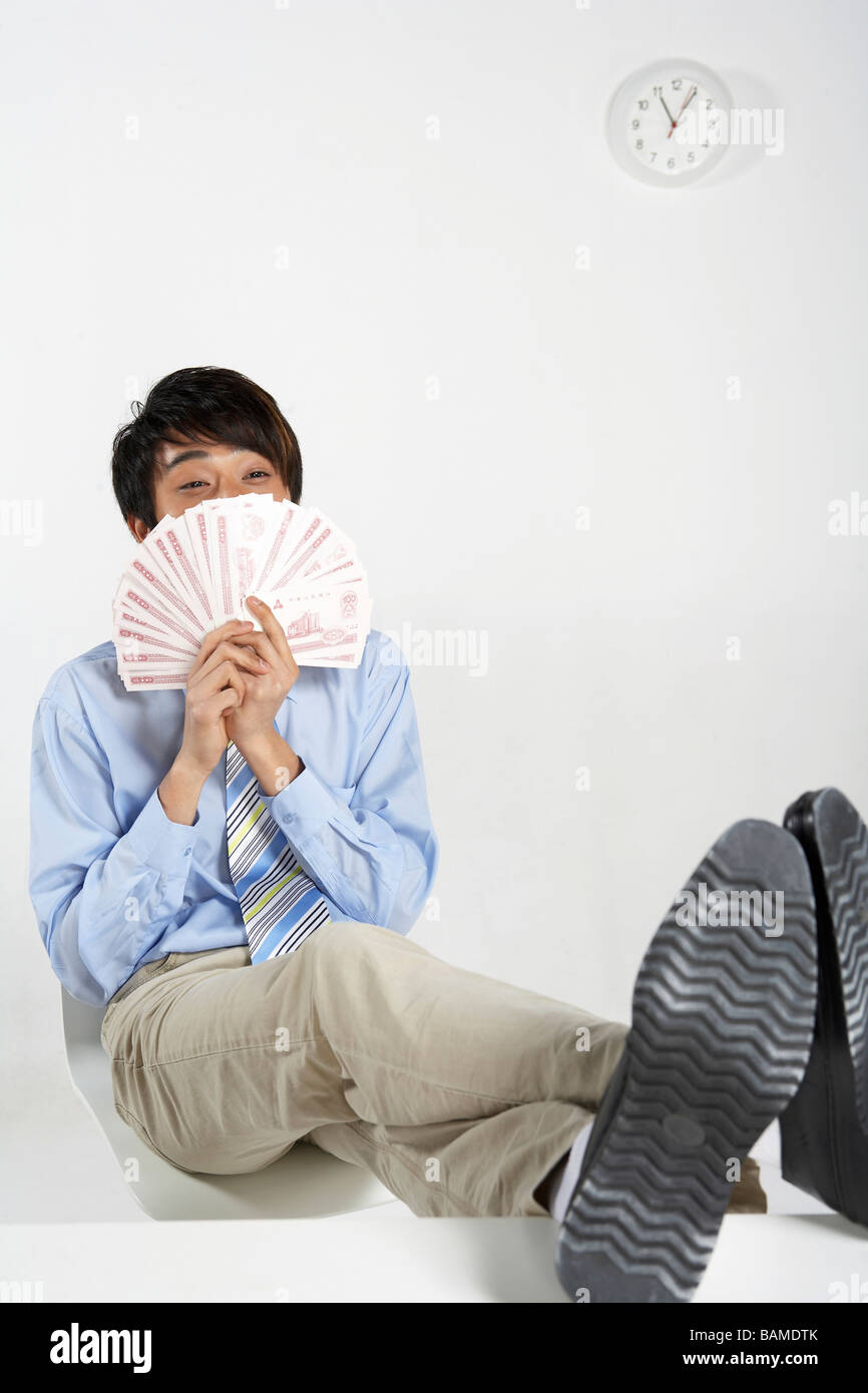 Young Man Holding Money Stock Photo - Alamy