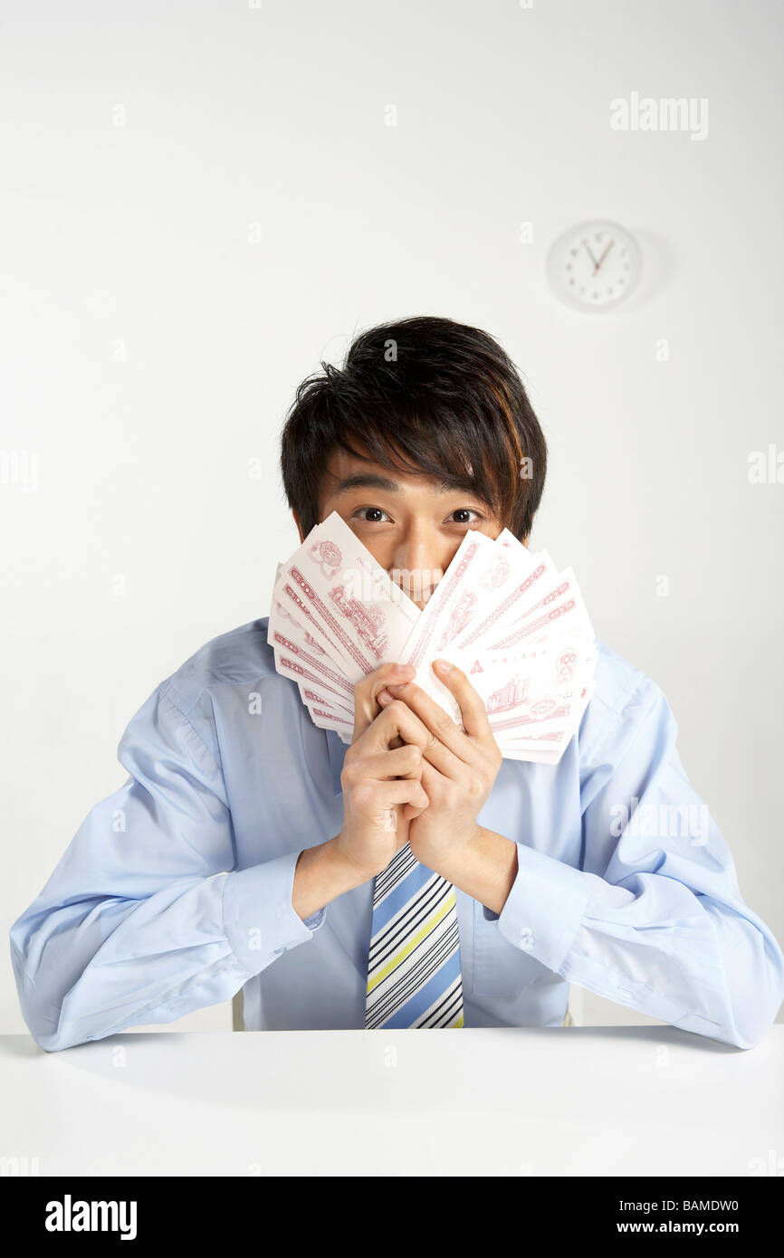Young Man Holding Money Stock Photo - Alamy
