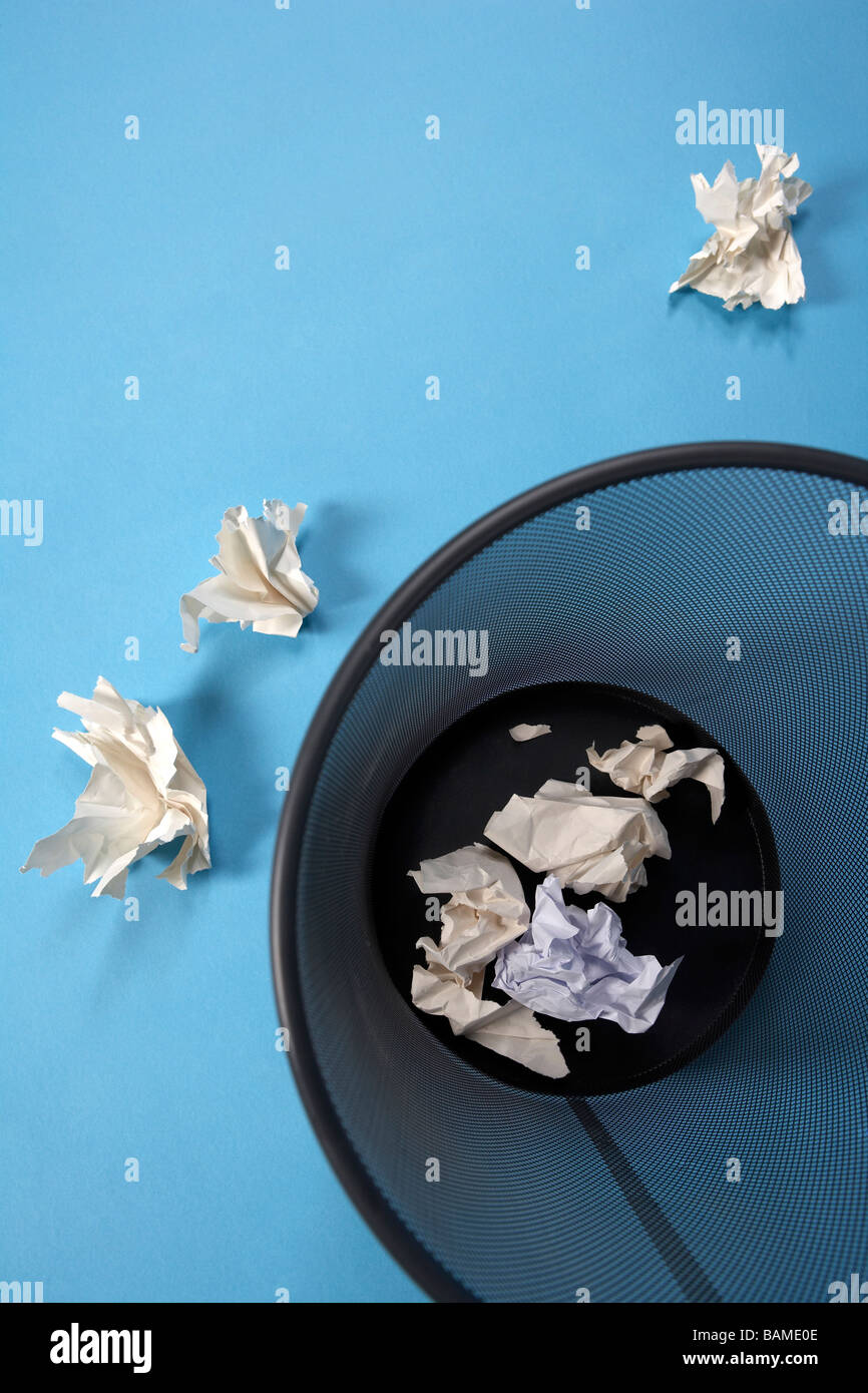 Rubbish Bin And Crumpled Paper Balls Stock Photo - Alamy
