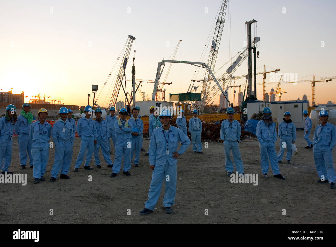 United Arab Emirates, Dubai, early morning, workers proud to have their ...