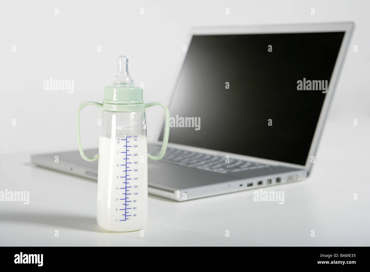 Baby Bottle And Laptop Stock Photo - Alamy