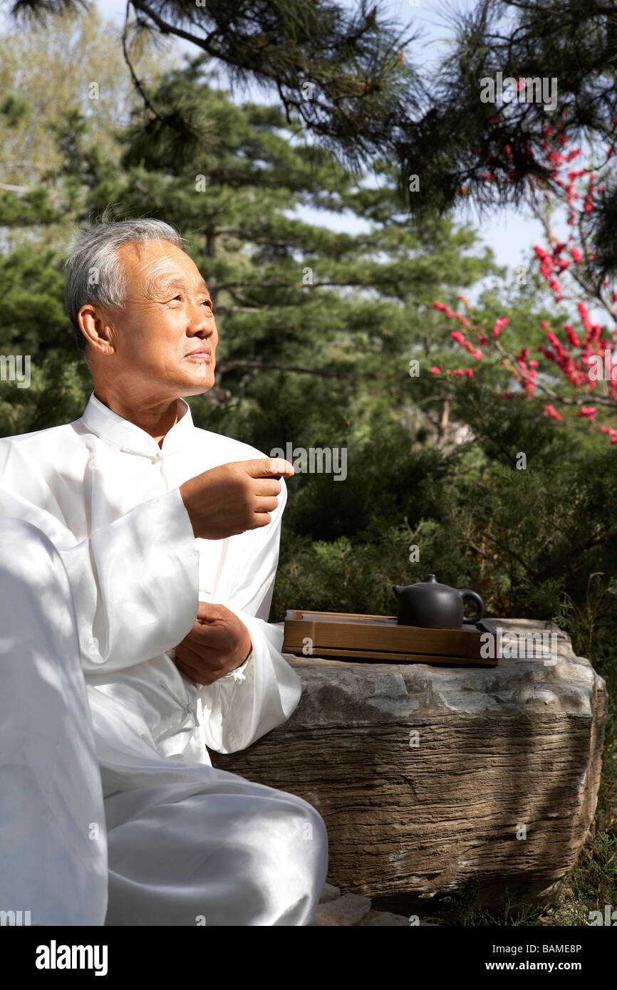 Portrait Of Elderly Man Drinking From Small Cup Stock Photo - Alamy