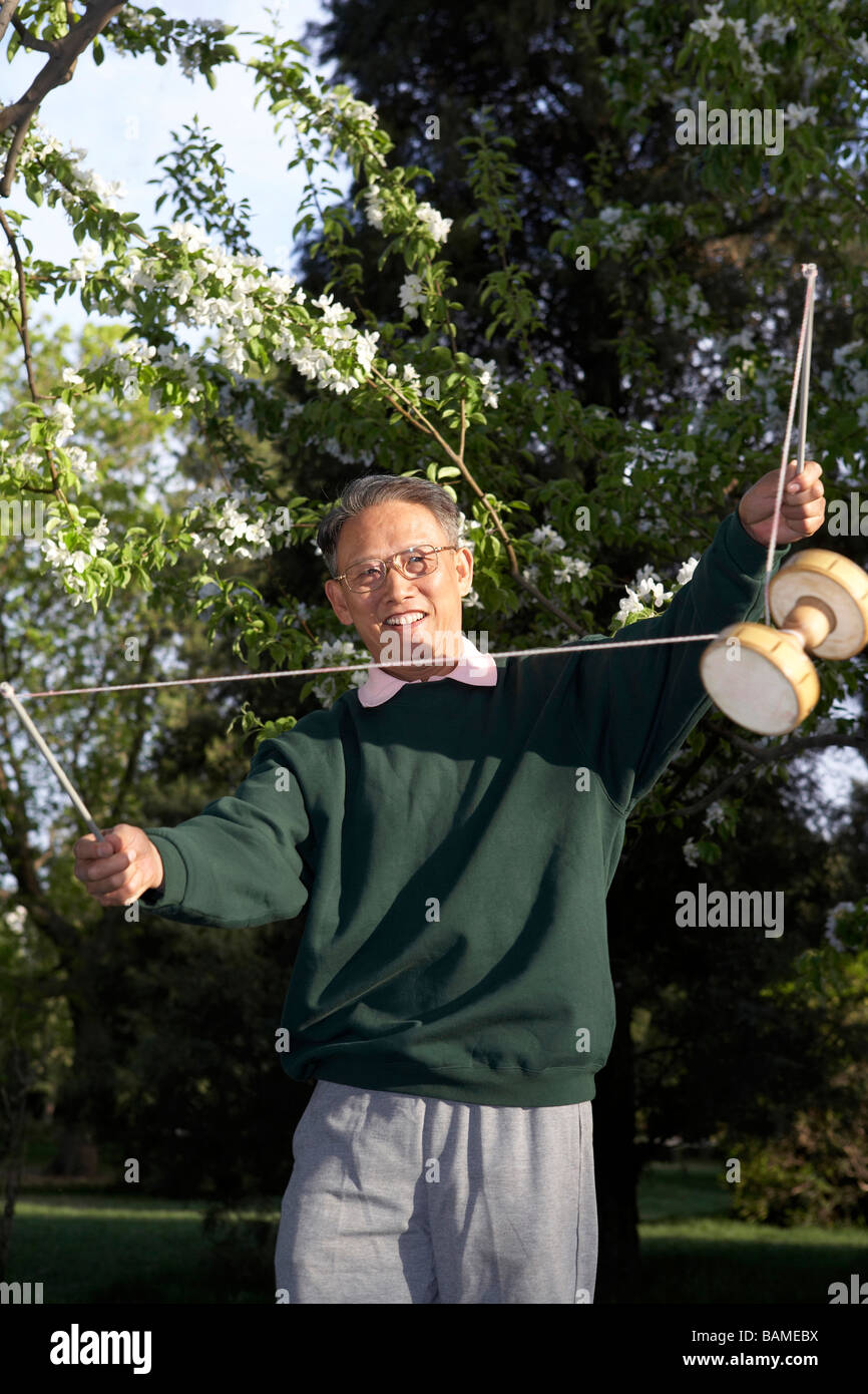 Senior Chinese Man Playing With Traditional Chinese Toy Diabolo Stock ...
