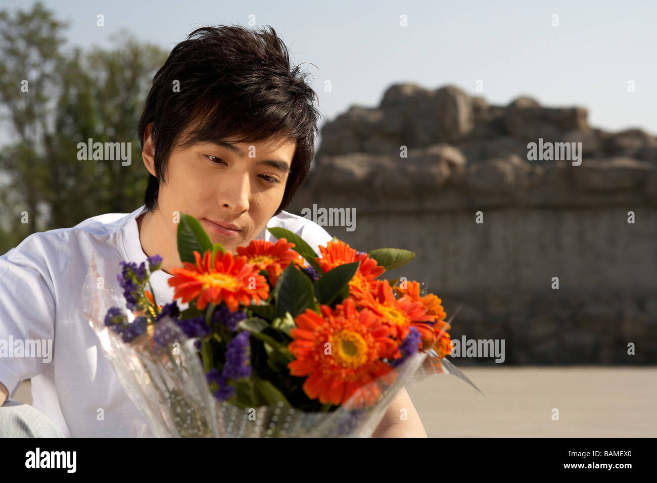 Man With Bouquet Of Flowers Stock Photo - Alamy