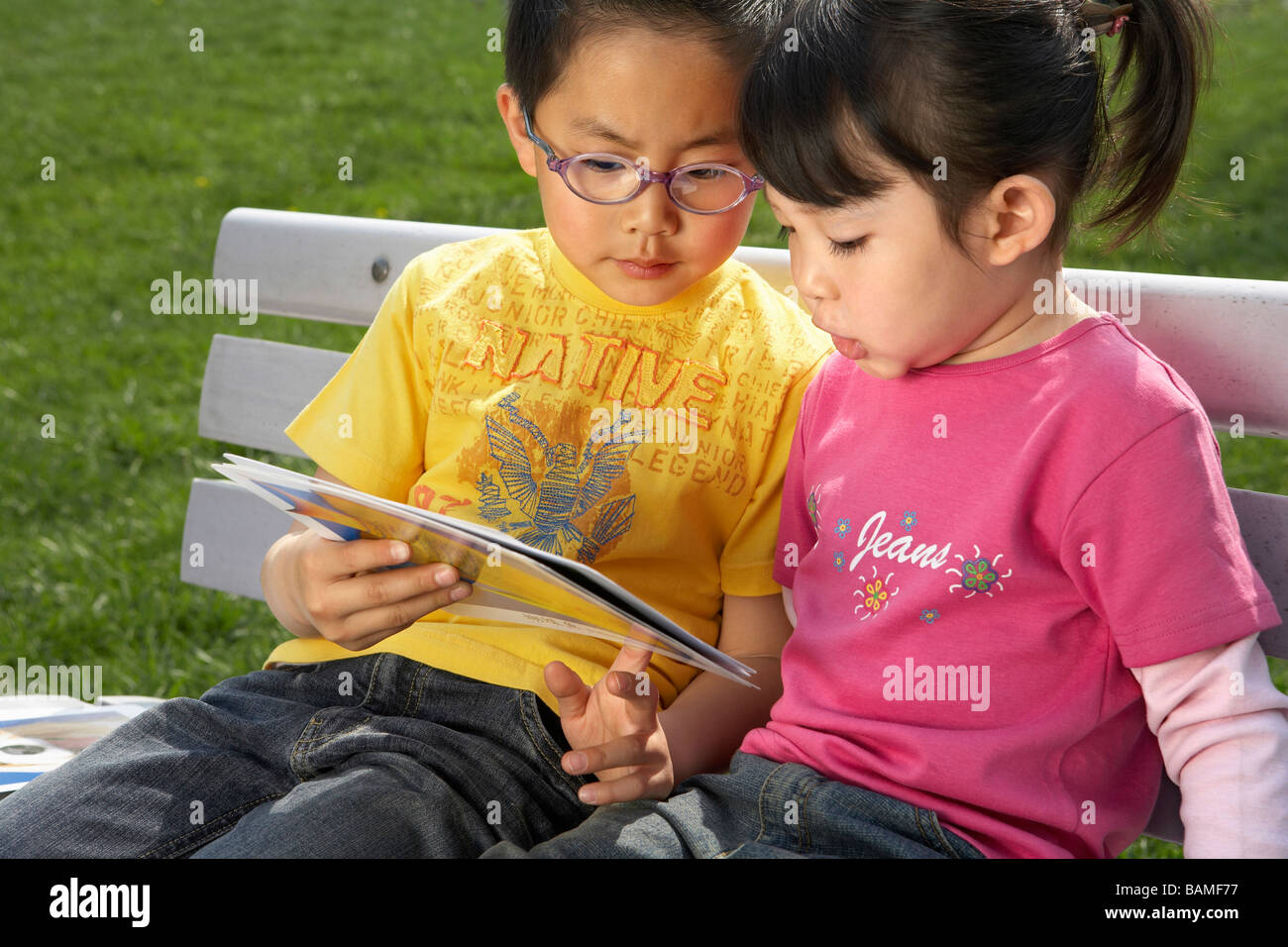 Children Reading Book Together Stock Photo - Alamy