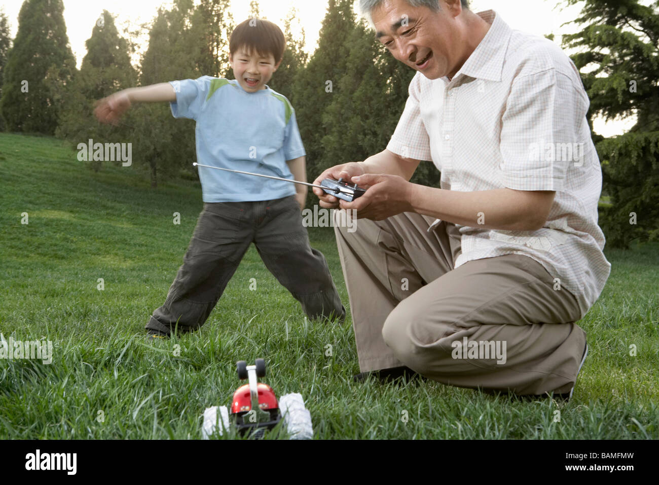 Two people with remote control cars hi-res stock photography and images ...