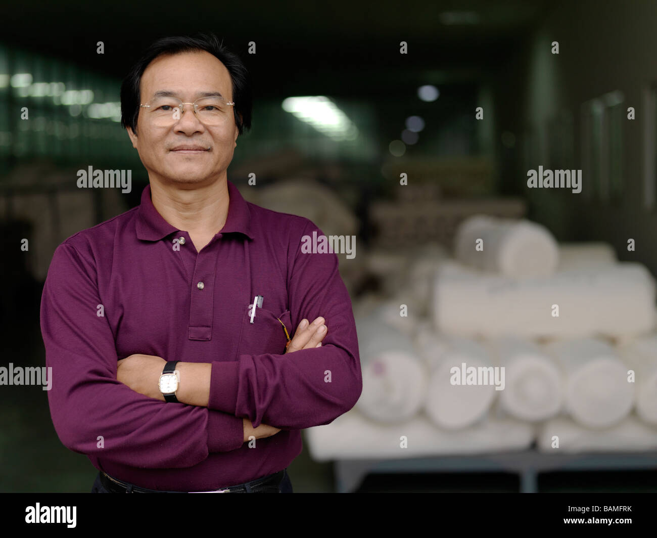 An employee of the New Wide Knitting and Dying factory in China Stock ...