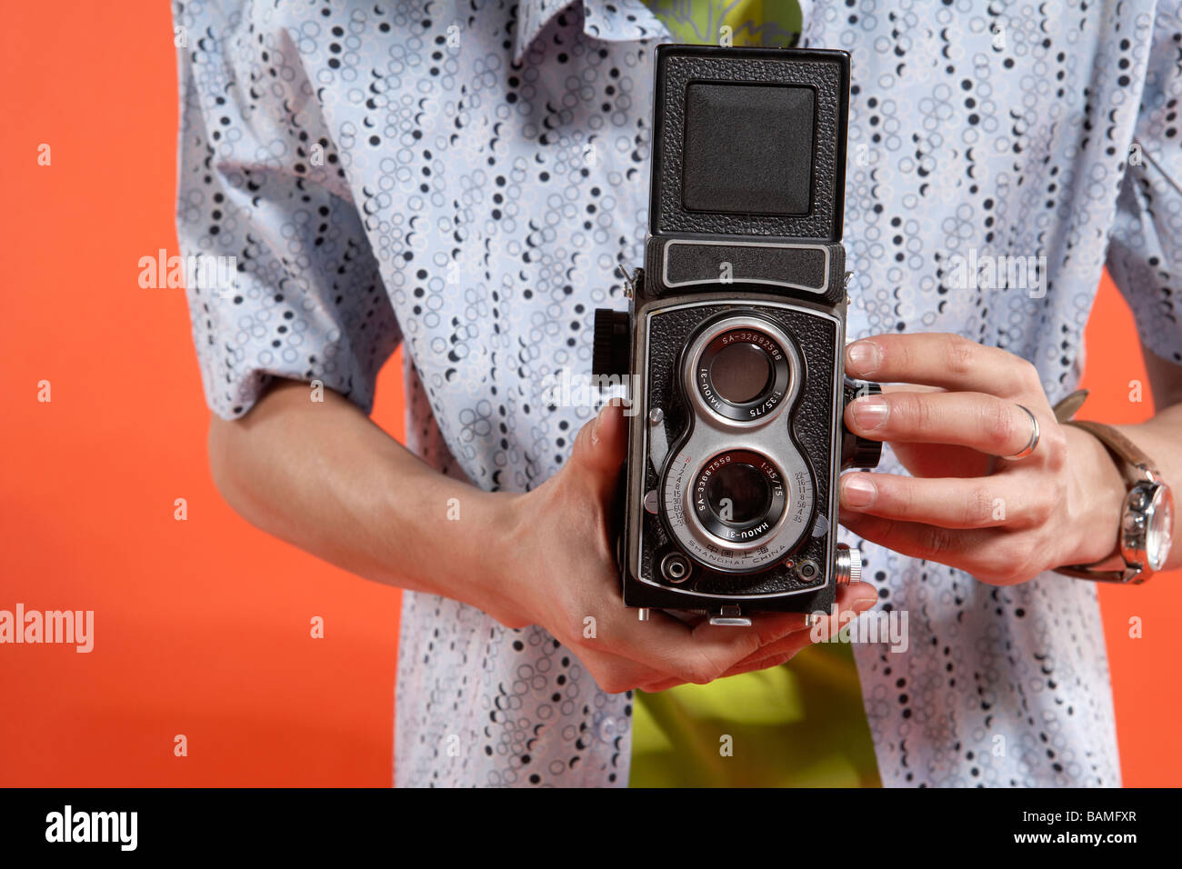 Young Man Holding Vintage Film Camera Stock Photo - Alamy