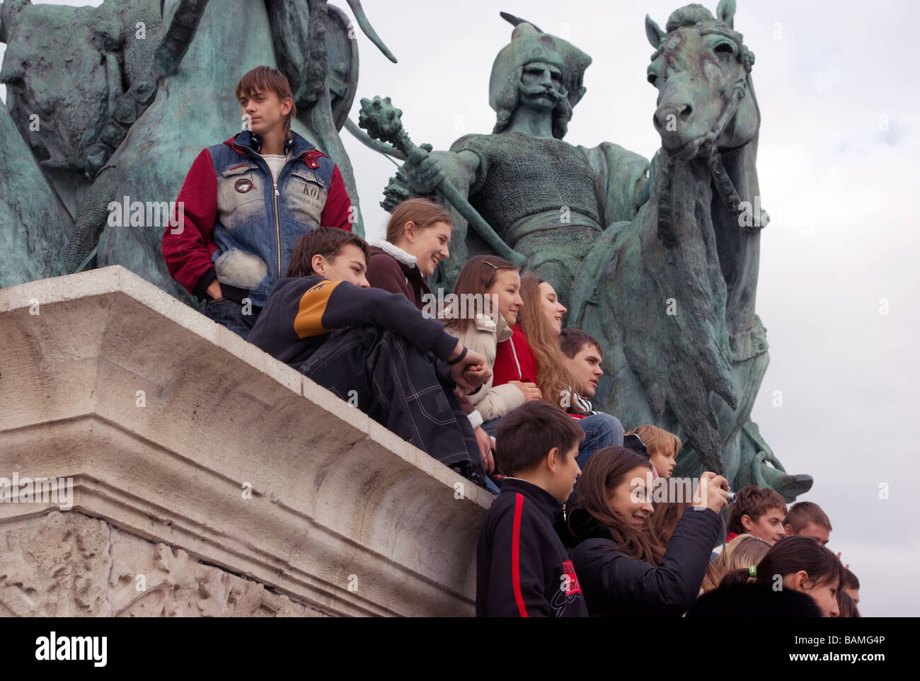 Teenagers posing for a group photo at the Millennium Monument in Heroes ...
