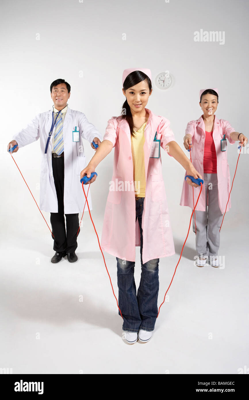 Nurses And Doctor Stretching With Skipping Rope Stock Photo - Alamy