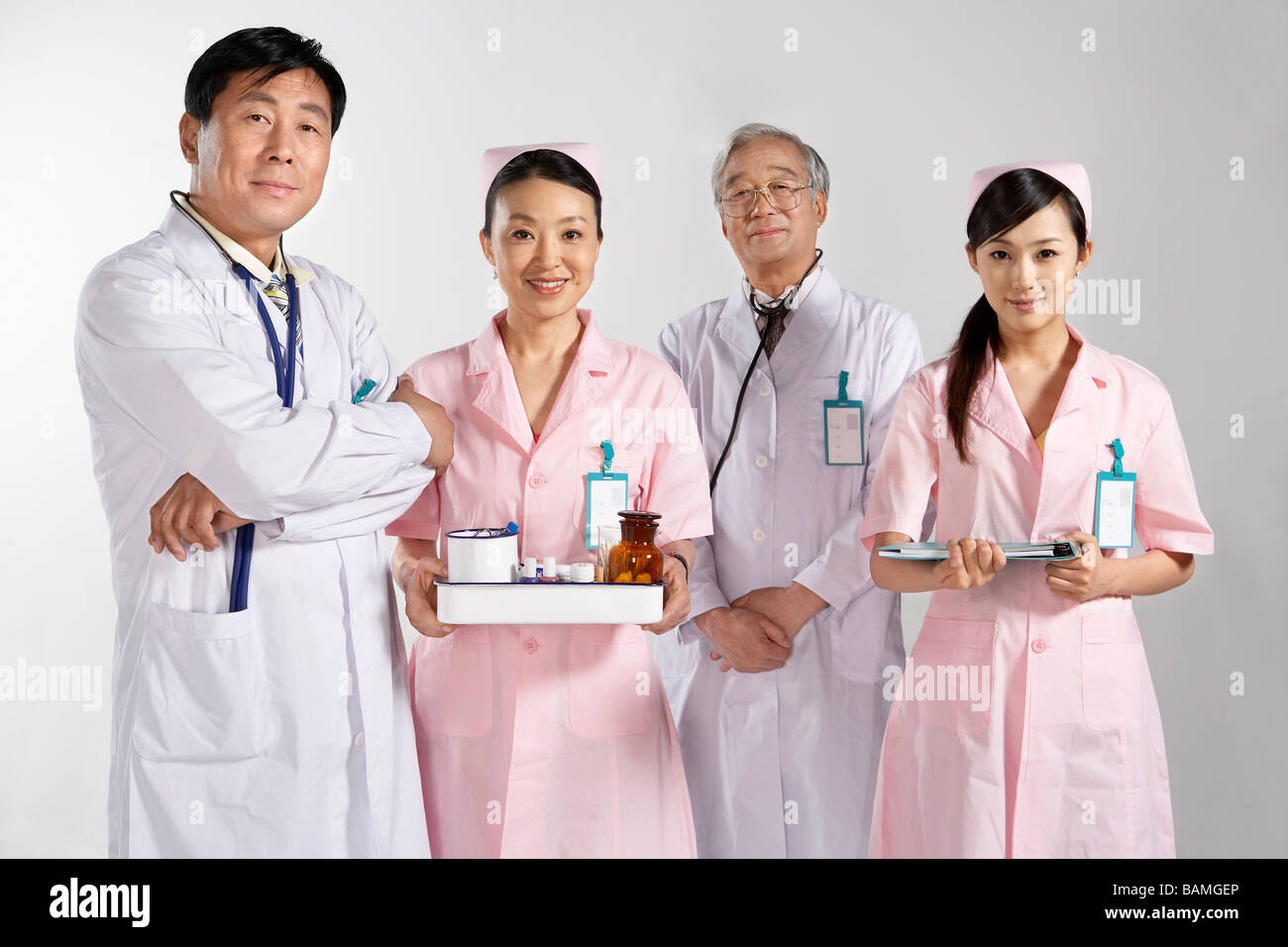 Doctors And Nurses With Medicine Trays Stock Photo - Alamy