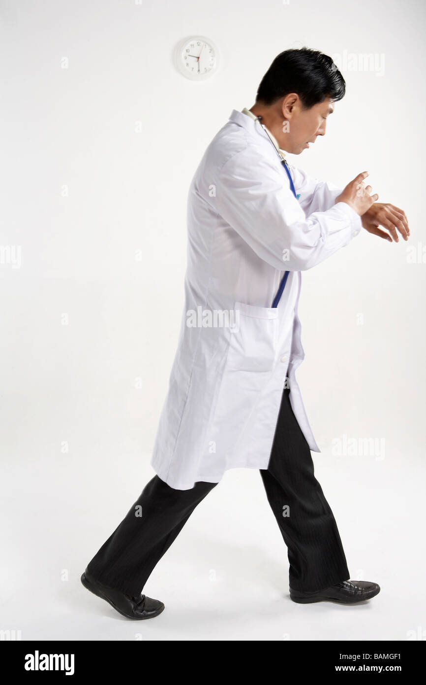 Doctor Looking At His Wristwatch Stock Photo - Alamy