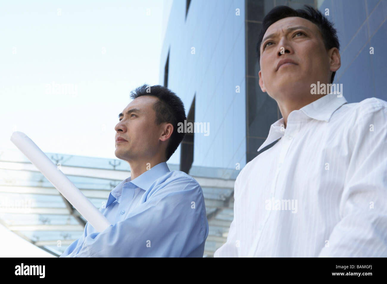 Businessmen Holding Blueprints Stock Photo - Alamy Businessmen Holding Blueprints Stock Photo - Alamy