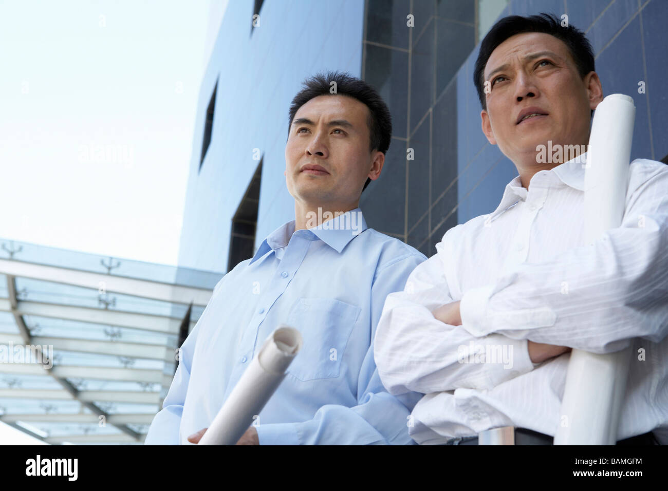 Businessmen Holding Blueprints Stock Photo - Alamy Businessmen Holding Blueprints Stock Photo - Alamy
