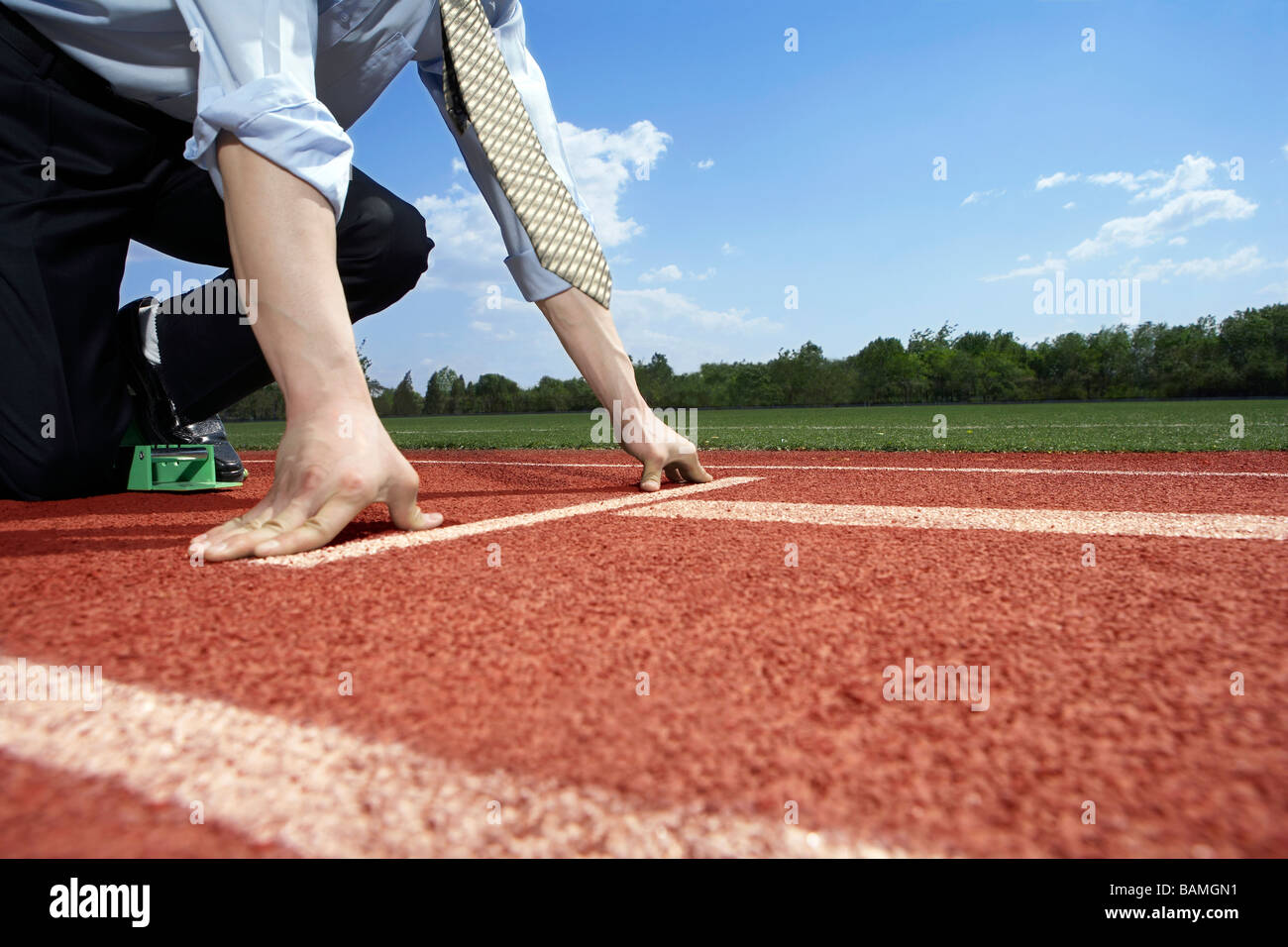 Close-Up Of Business Man Lined Up On A Race Track Stock Photo - Alamy