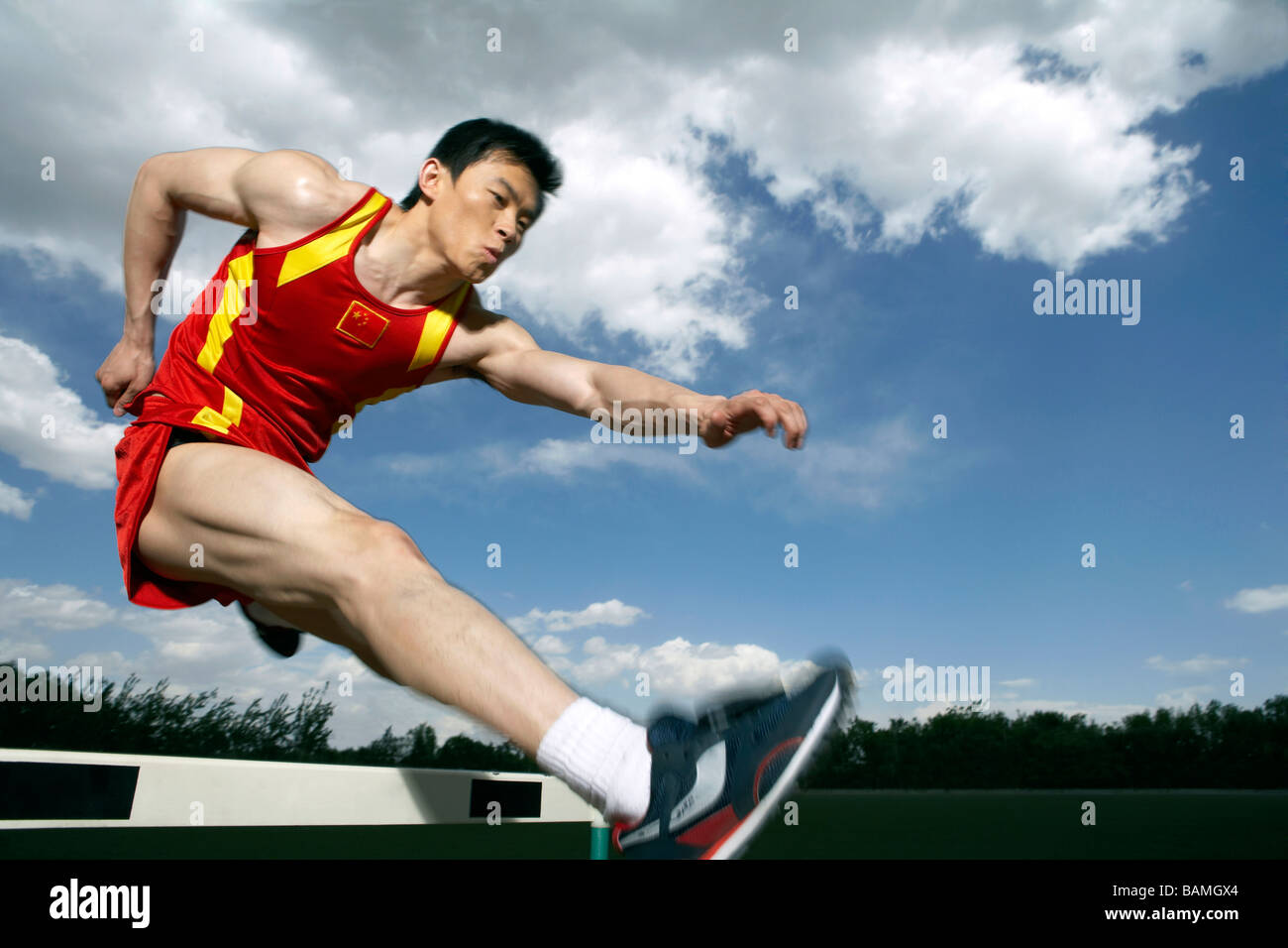 Blurred view of athlete jumping hurdles hi-res stock photography and ...