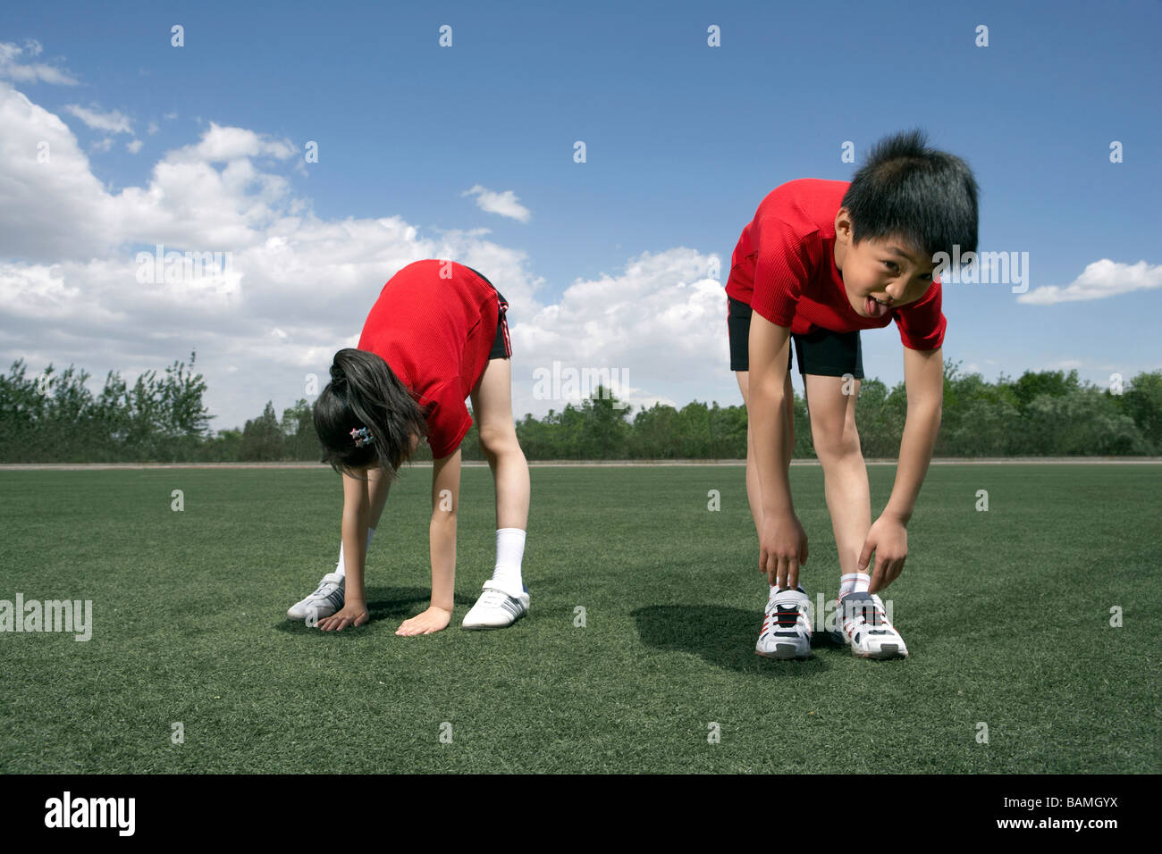 Children Stretching, Touching Their Toes Stock Photo - Alamy