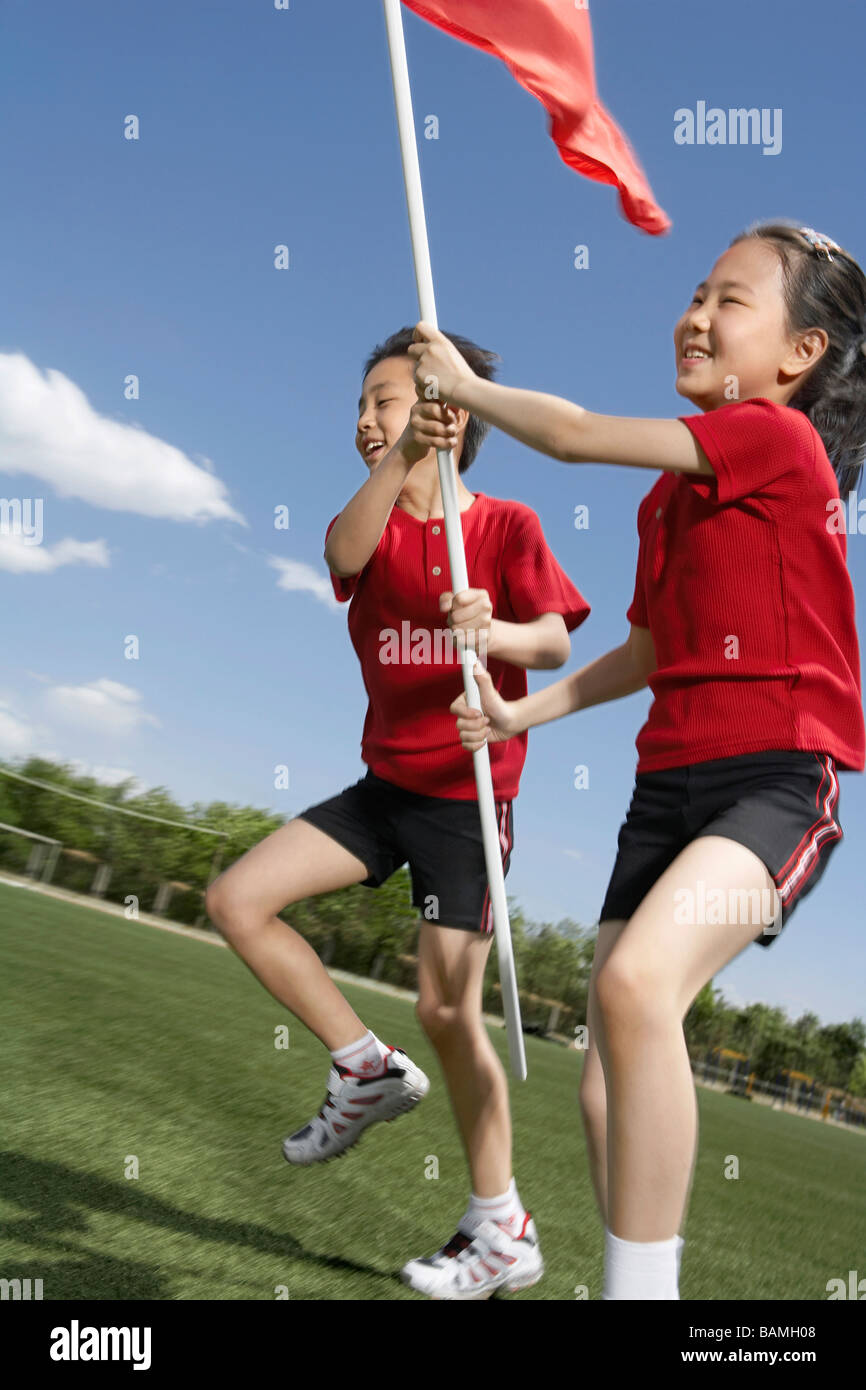 Girls with red flags china hi-res stock photography and images - Alamy