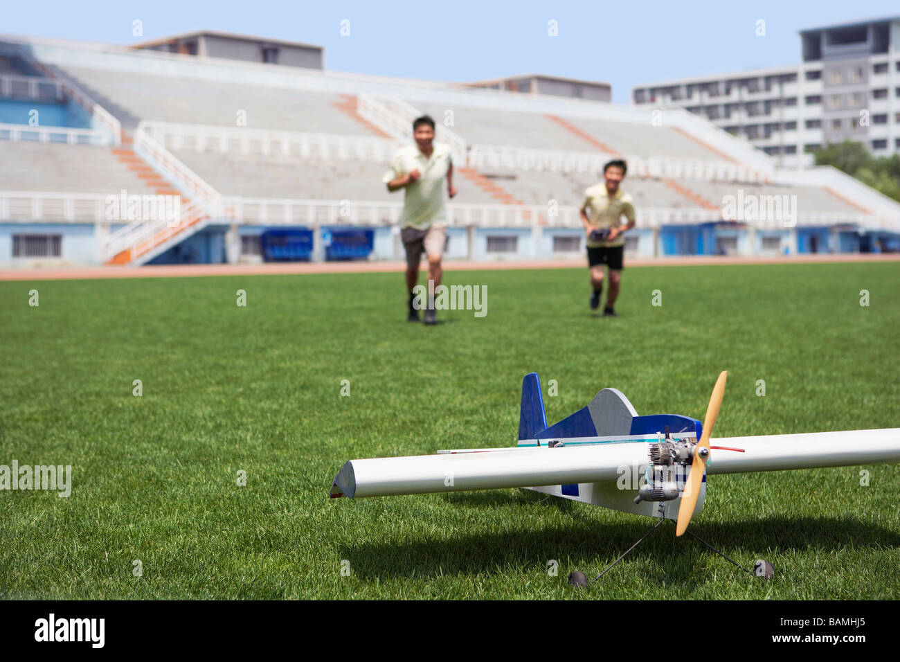 Father And Son Playing With Model Airplane Stock Photo - Alamy