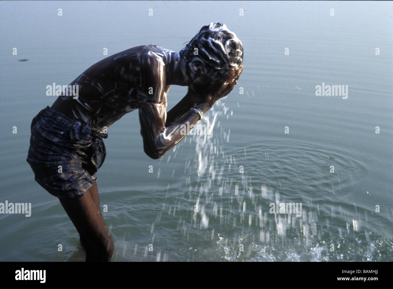 Man washing in pond hi-res stock photography and images - Alamy