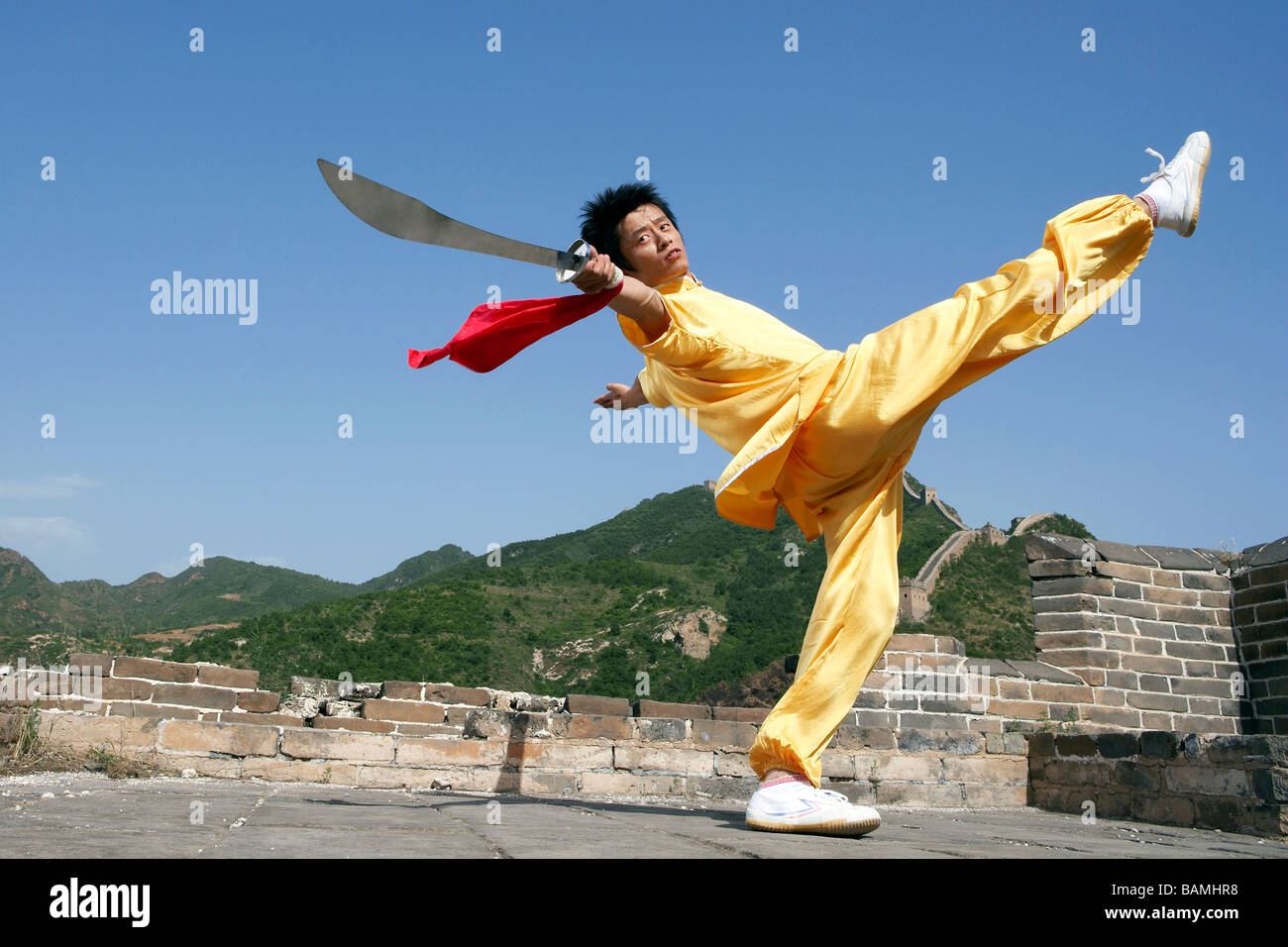 Portrait Of Young Man Practicing Martial Arts On The Great Wall Of ...