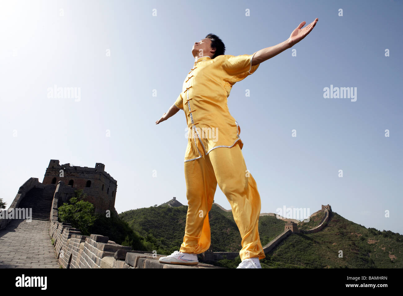 Man Practicing Martial Arts In Traditional Dress On The Great Wall Of ...