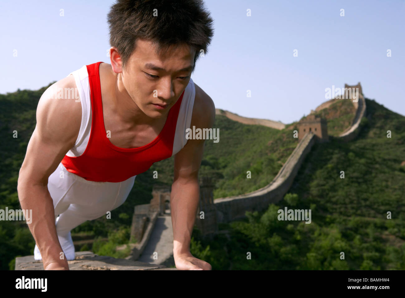 Gymnast Doing Push Up On The Great Wall Of China Stock Photo - Alamy
