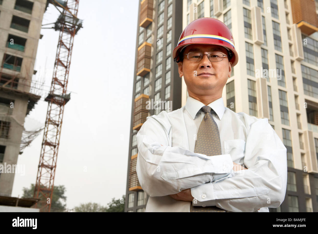 Construction Contractor Standing On Building Site Stock Photo - Alamy