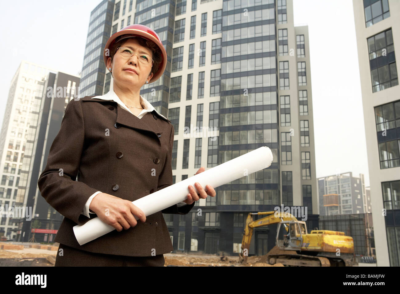 Construction Contractor Holding Building Plans, Looking Into The ...