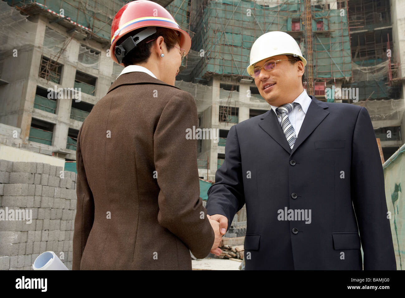 Construction Contractors Shaking Hands Stock Photo - Alamy